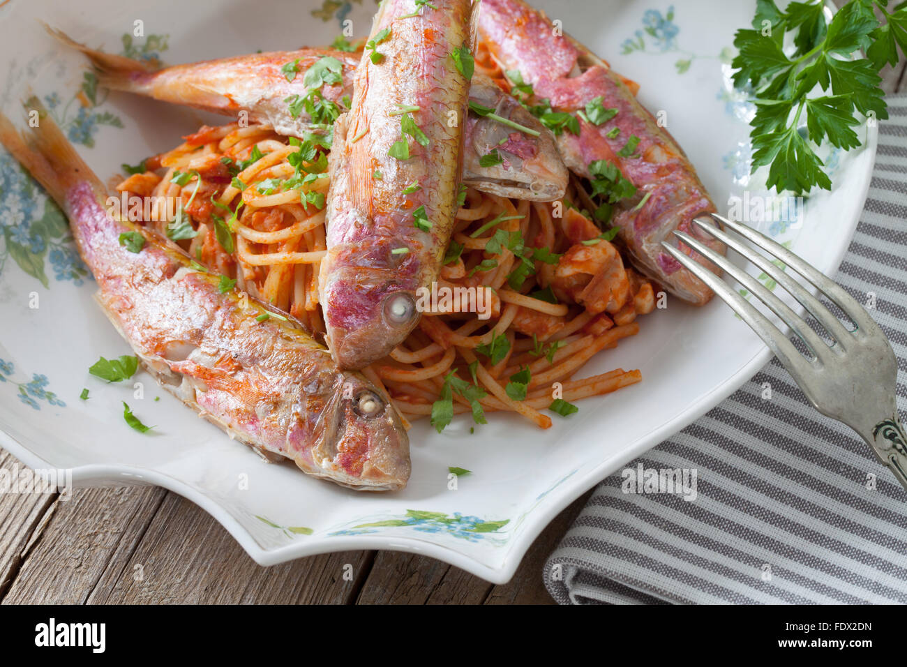 Red Mullet Fish On Spaghetti Stock Photo - Alamy