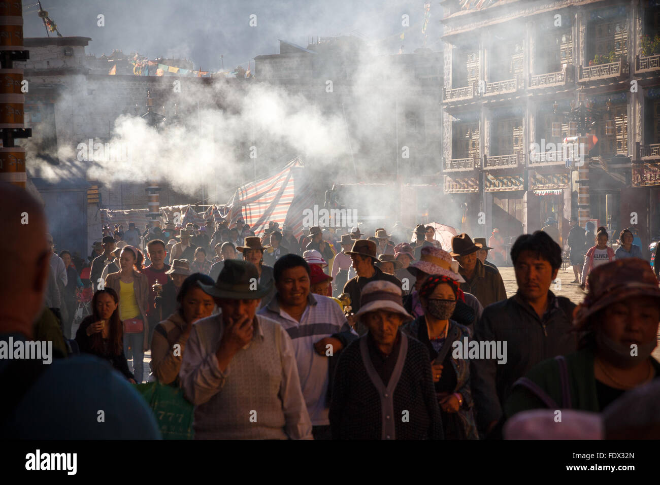 [Editorial Use Only] People walking in the evening sun in the center of ...