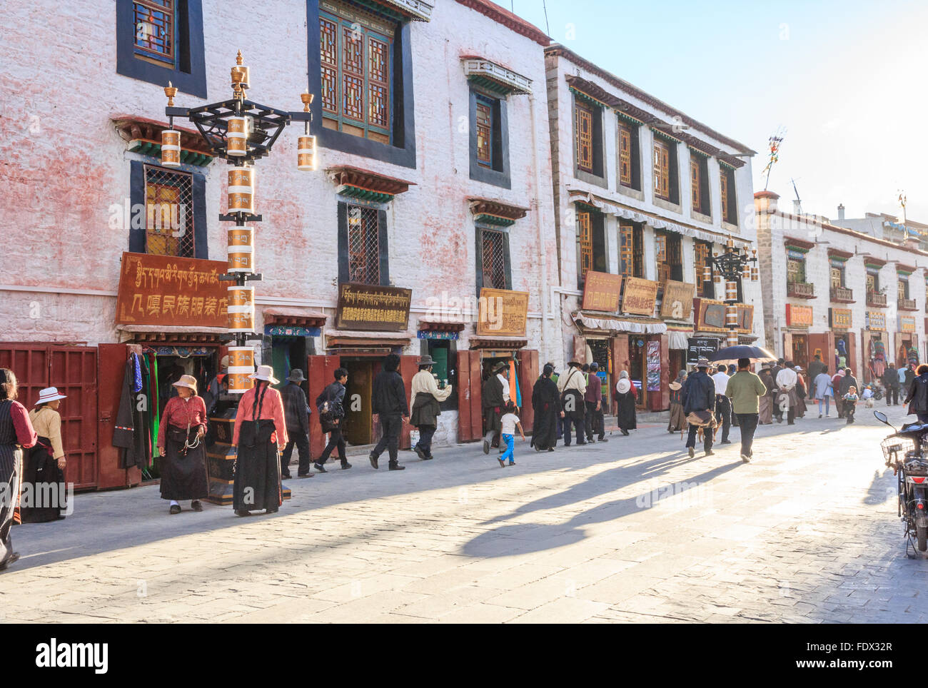 [Editorial Use Only] People walking in the evening sun in the city ...