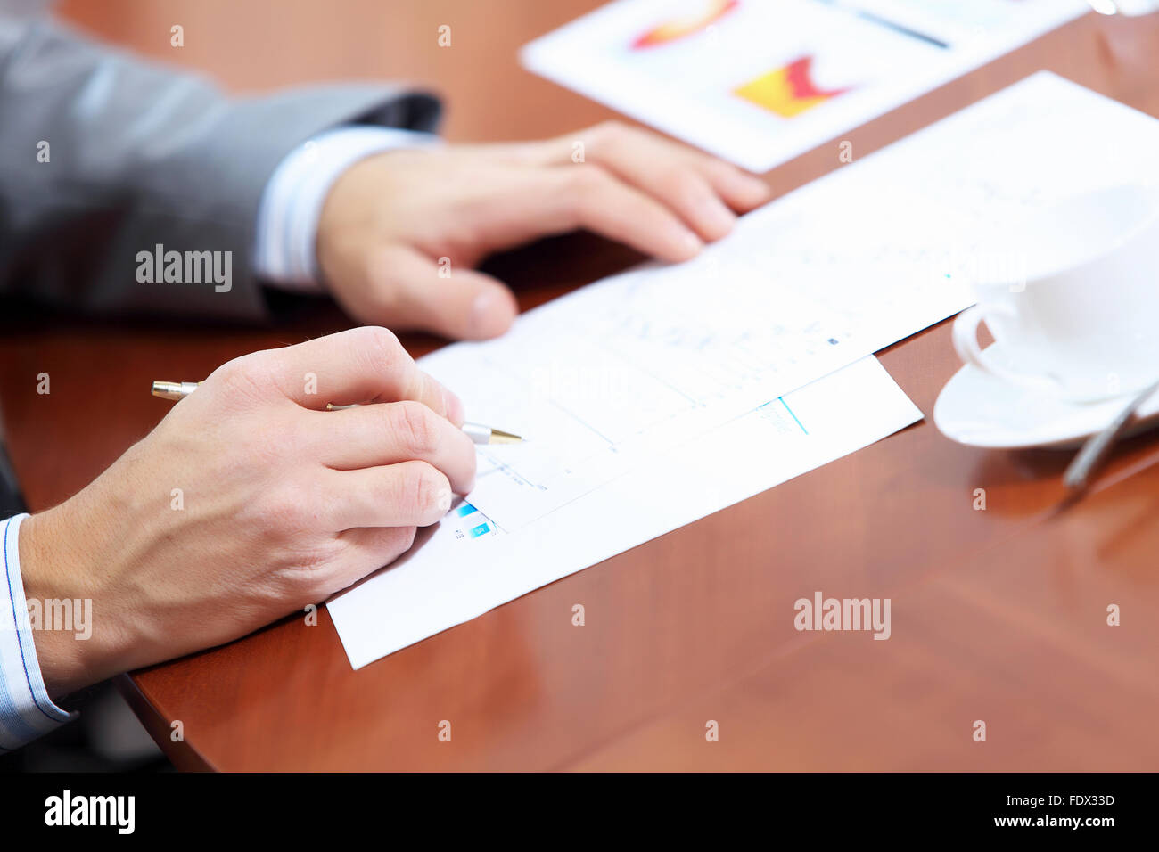 Image of businessman's hands signing documents at meeting Stock Photo ...