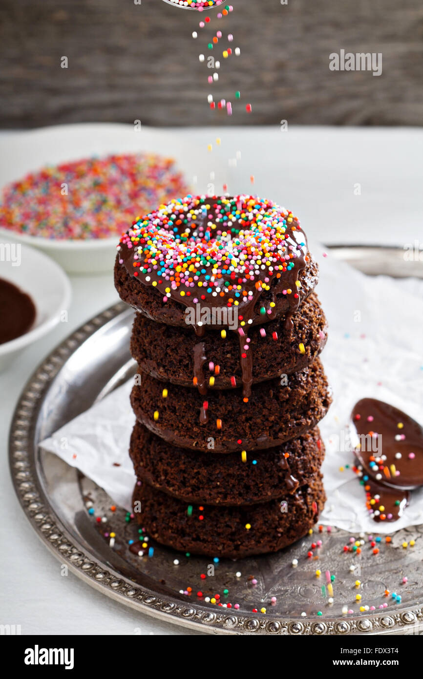 Stack of homemade baked chocolate donuts with sprinkles Stock Photo - Alamy