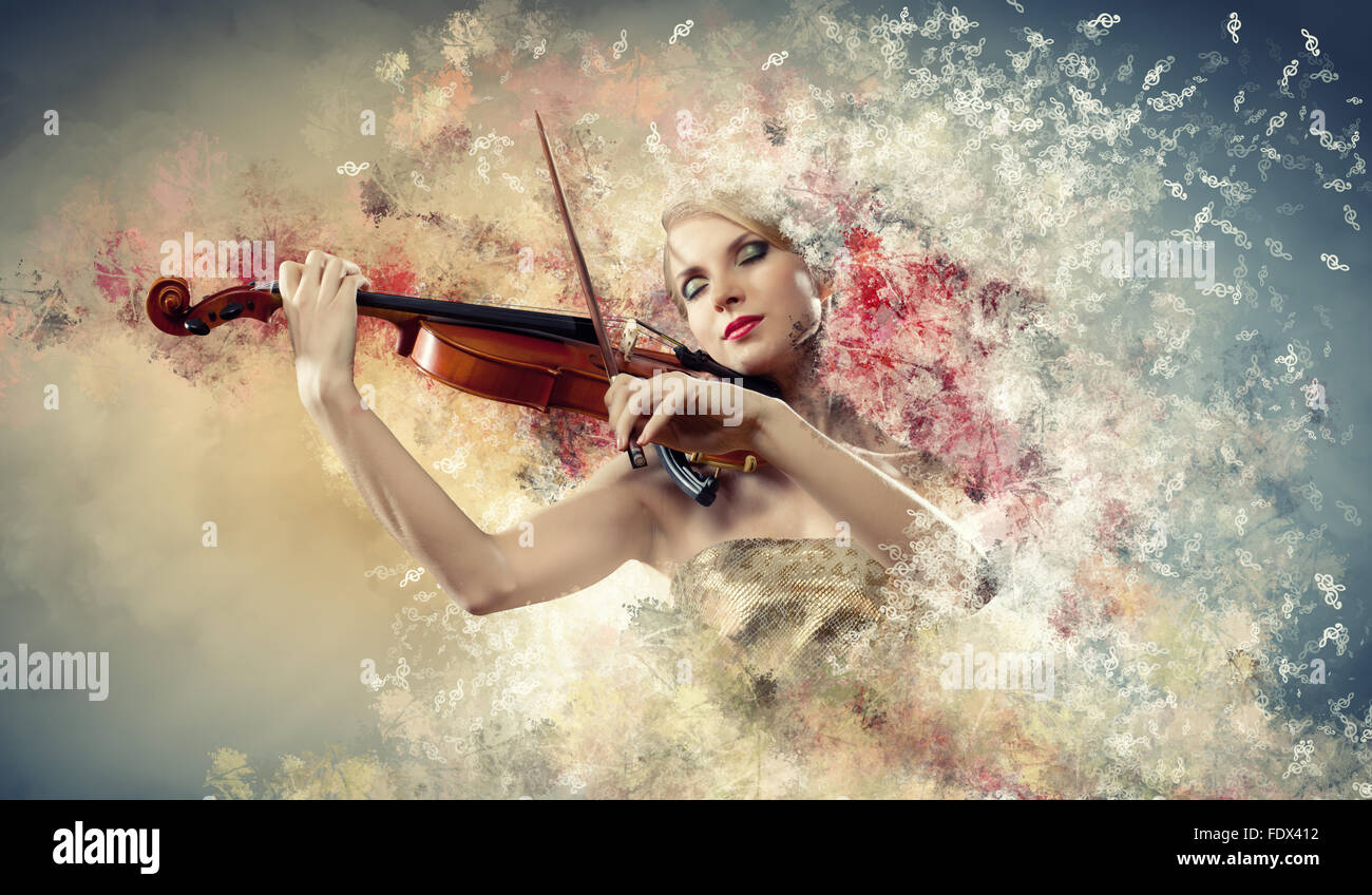 Image of beautiful female violinist playing with closed eyes against ...