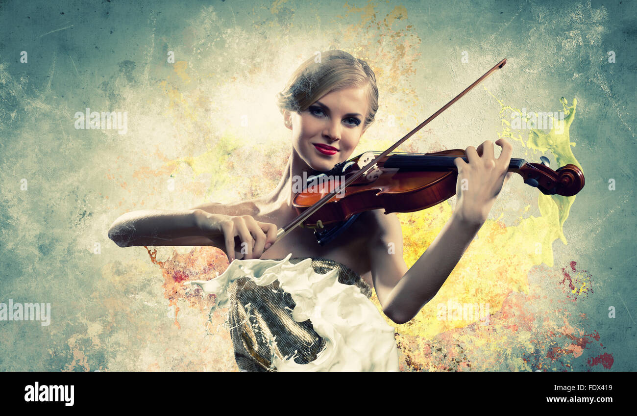Image of beautiful female violinist playing against splashes background ...