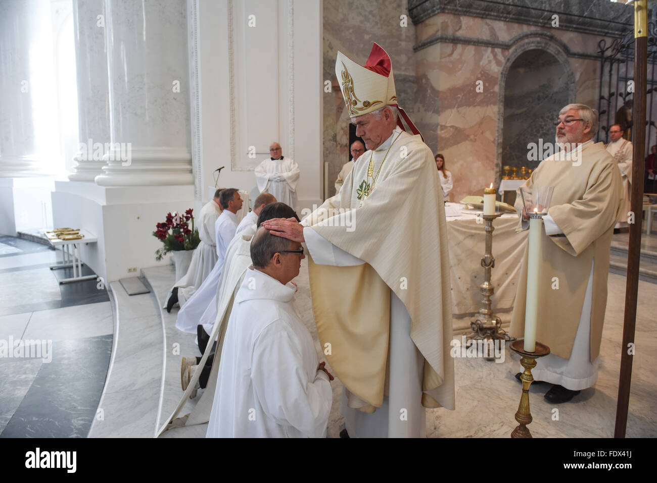 Laying on hands in church hi-res stock photography and images - Alamy