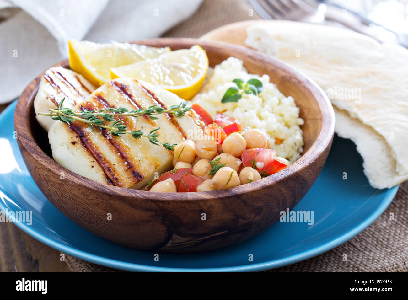 Chickpea salad, cous-cous and grilled cheese with pita bread Stock ...