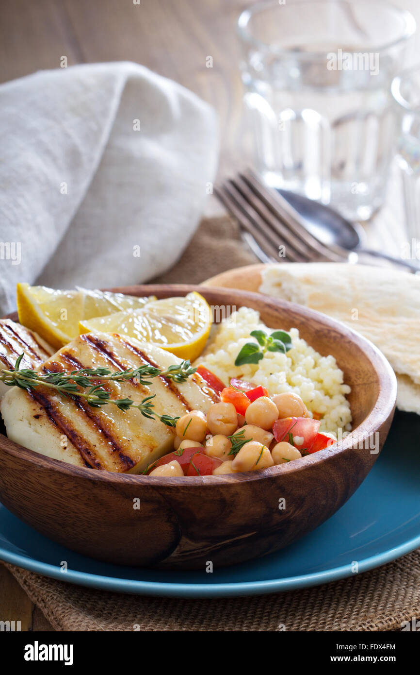 Chickpea salad, cous-cous and grilled cheese with pita bread Stock ...