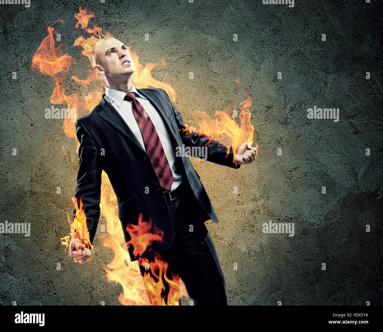 Image of young businessman in anger burning in fire Stock Photo - Alamy