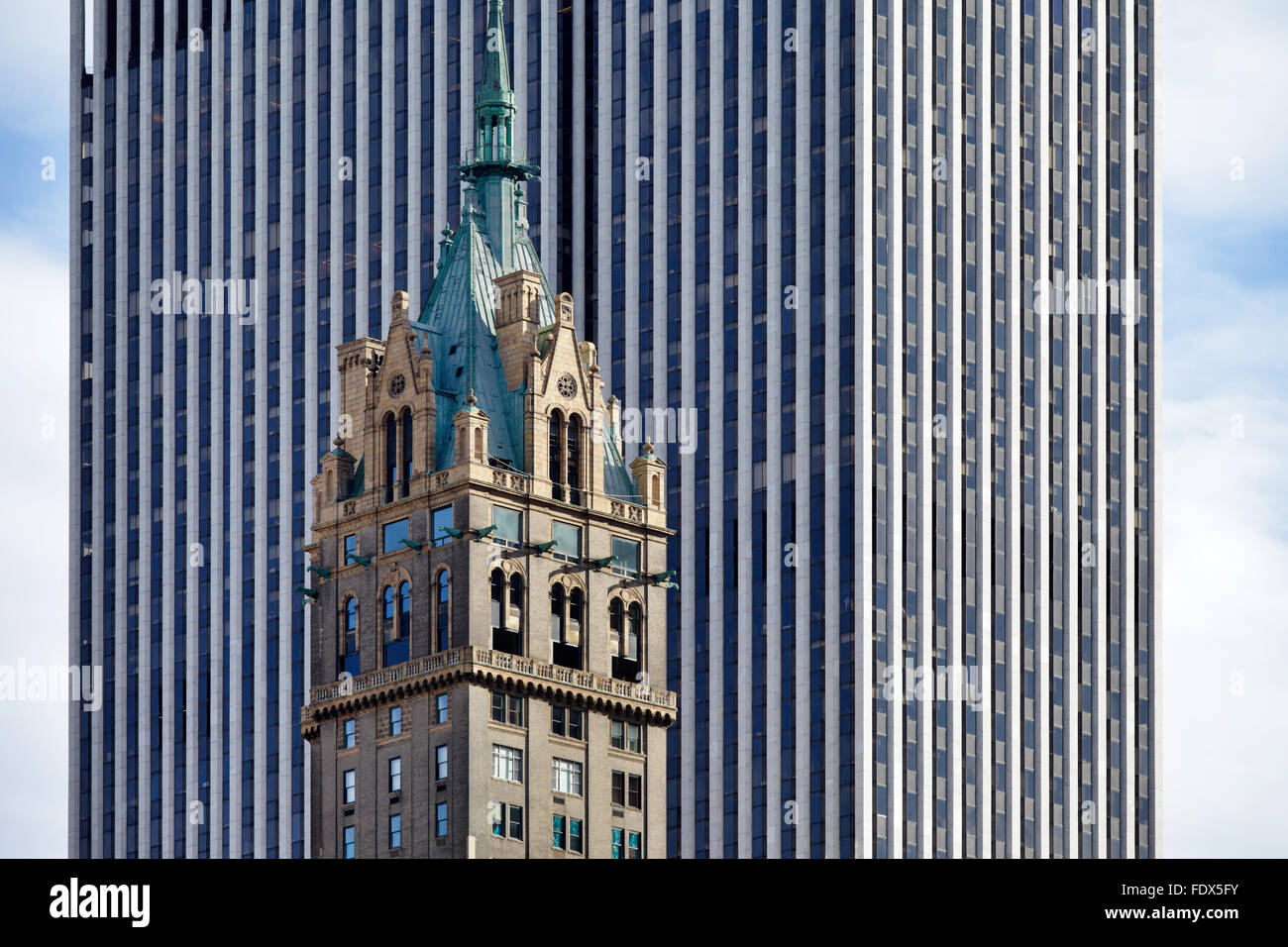 New York City, USA, the tower of an old skyscraper in front of a modern ...