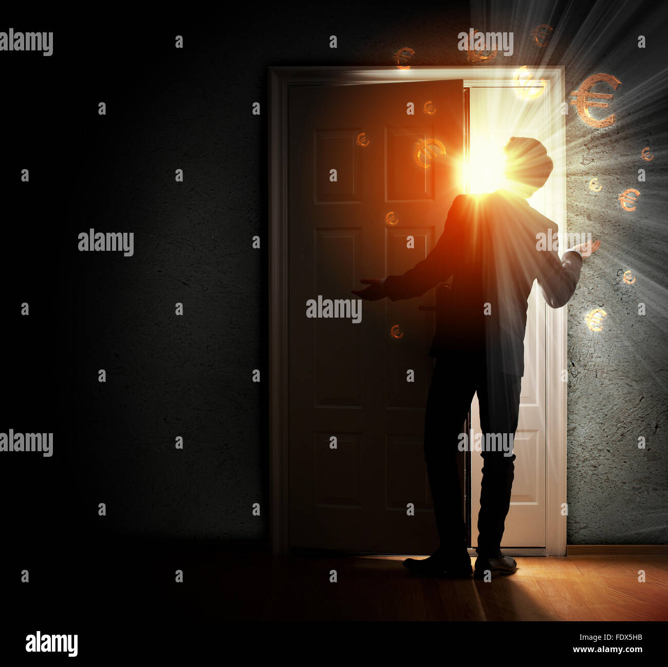 Image of young businessman standing with back opening door against euro ...