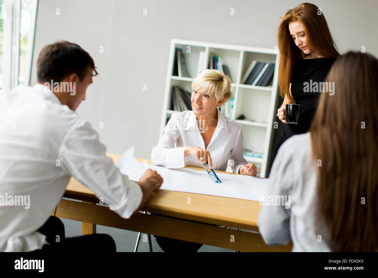 Teamwork in the office Stock Photo - Alamy