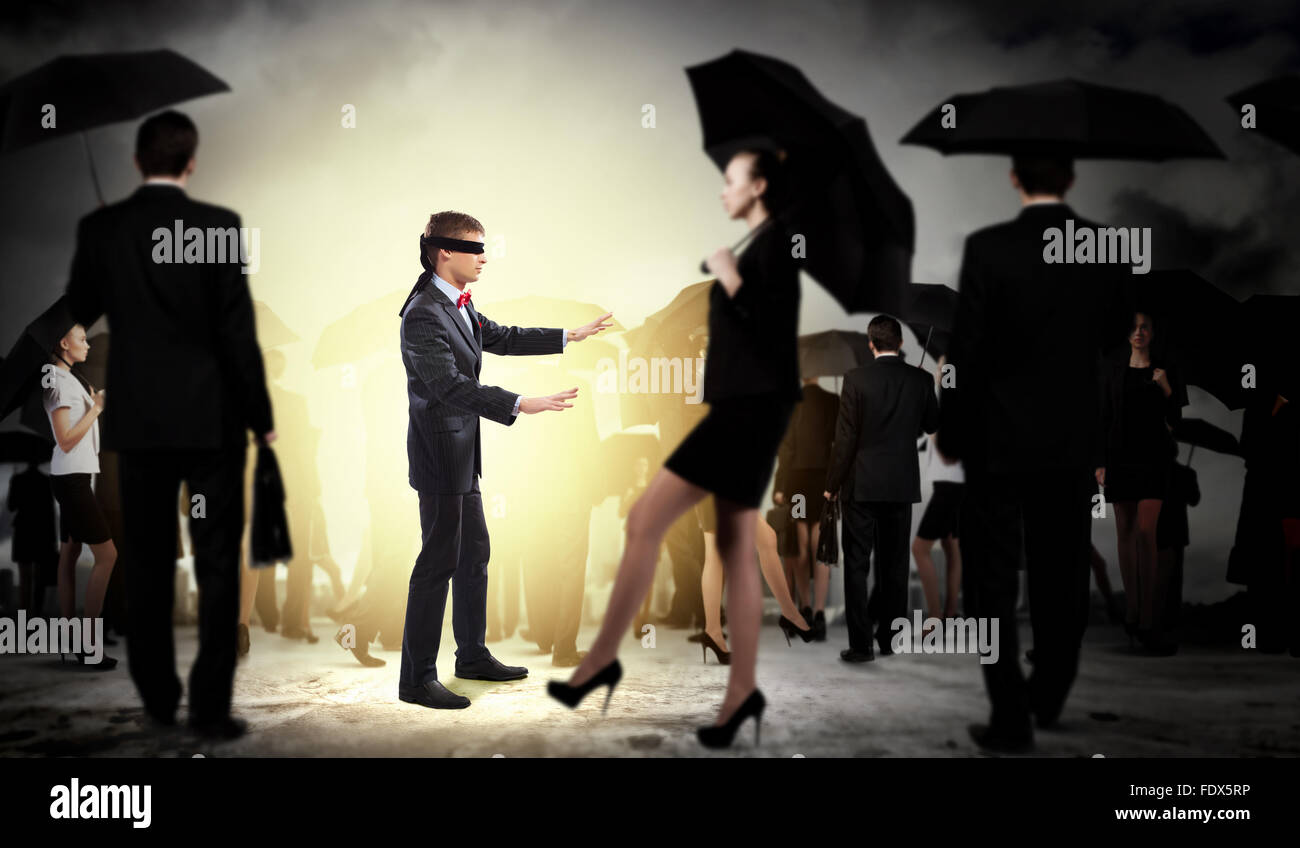 Image of businessman in blindfold walking among group of people Stock ...