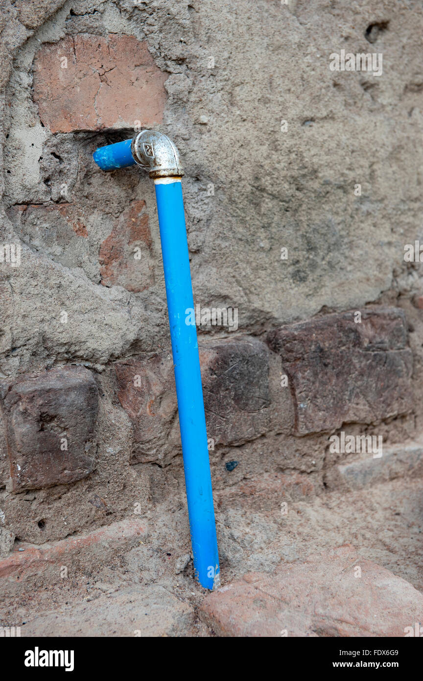 Pipe into Ugandan home carrying methane gas collected from cow manure ...