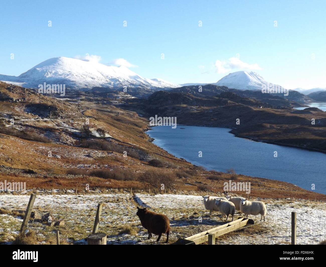 Snowy mountain at the end of Loch Inchard, near Kinlochbervie in ...