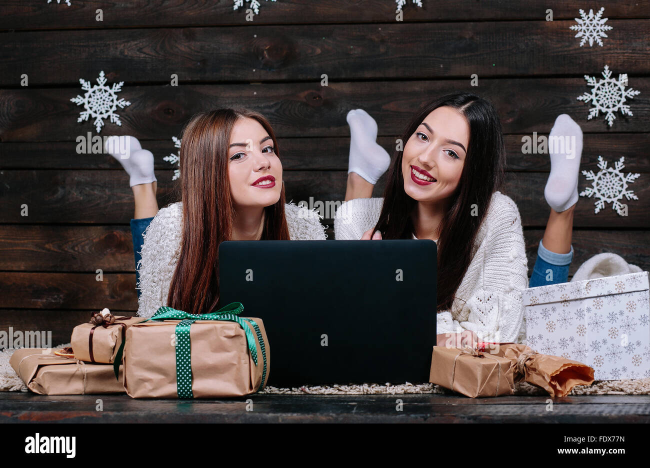 Two beautiful girls lie on the floor Stock Photo - Alamy