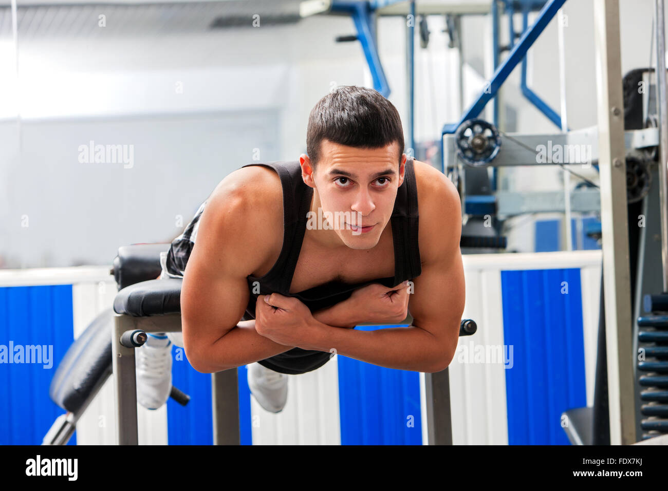 Man hard working his back on hyperextension bench Stock Photo - Alamy