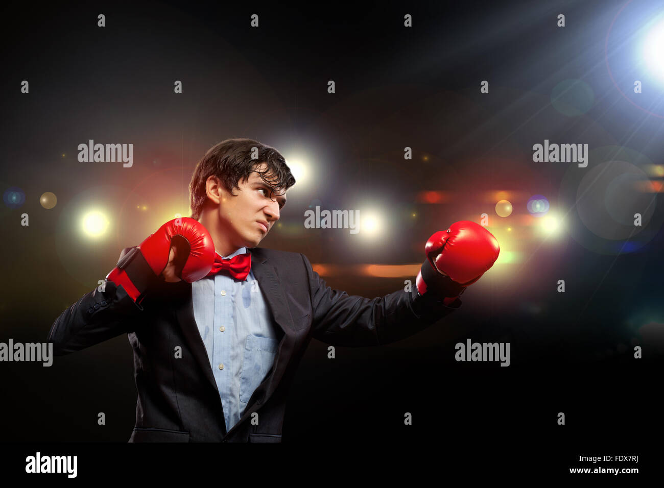 Portrait of a young businessman boxing. conceptual collage Stock Photo ...