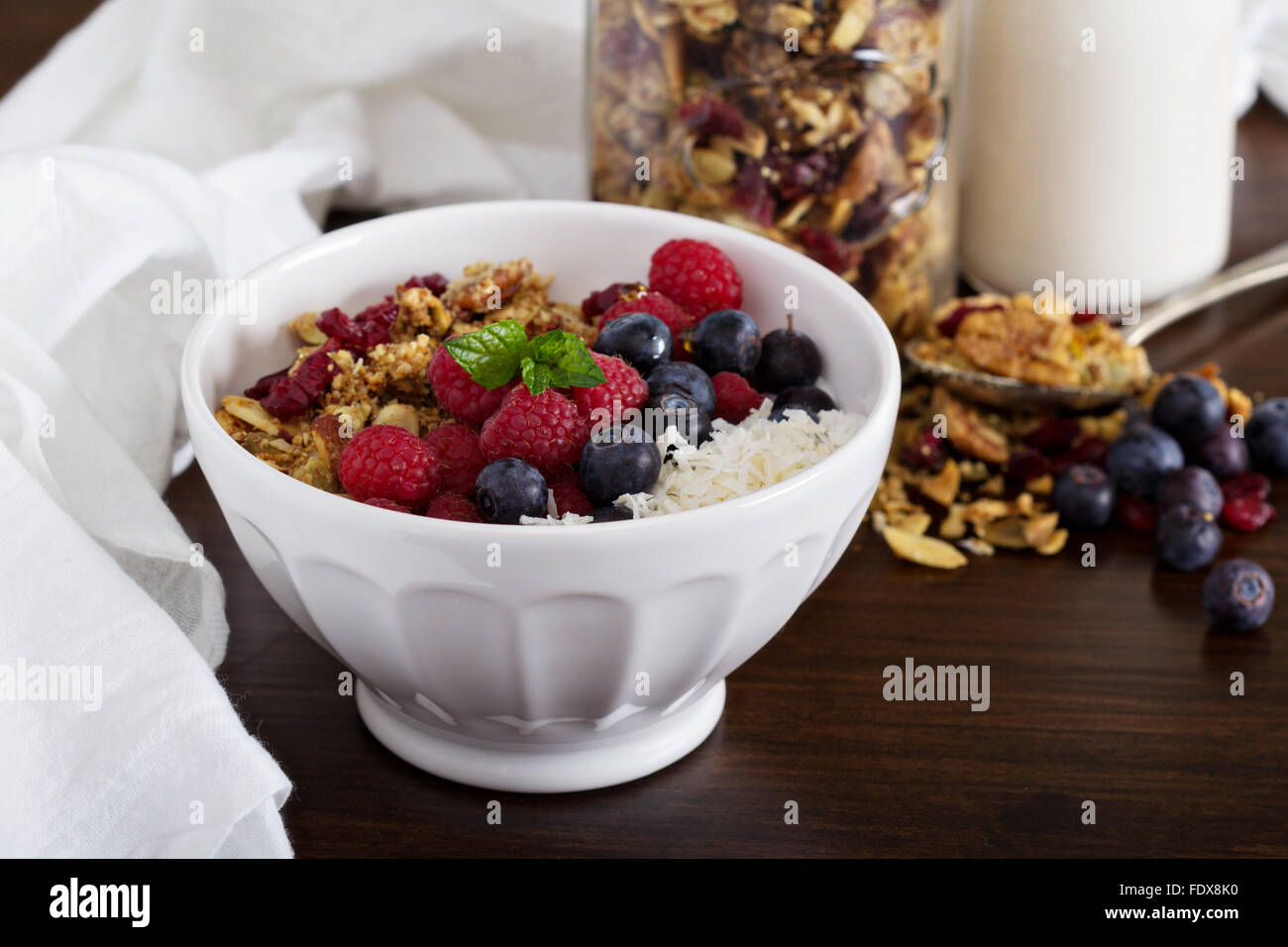 Homemade granola with berries and coconut flakes Stock Photo - Alamy