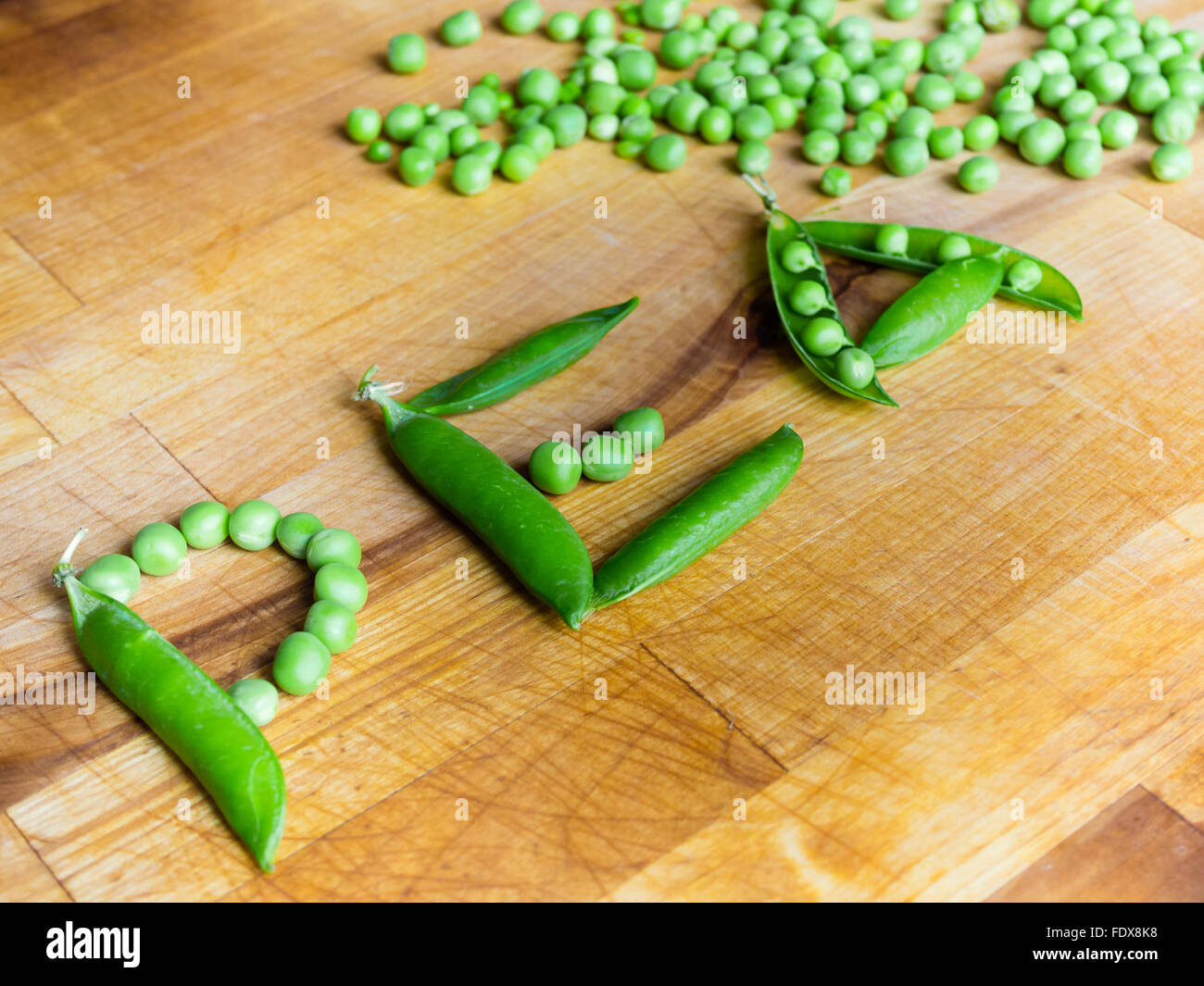 Word PEA written with peas Stock Photo - Alamy