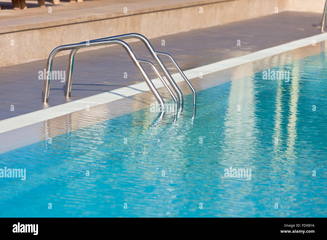 Ladder of a swimming pool. Horizontal shot Stock Photo - Alamy