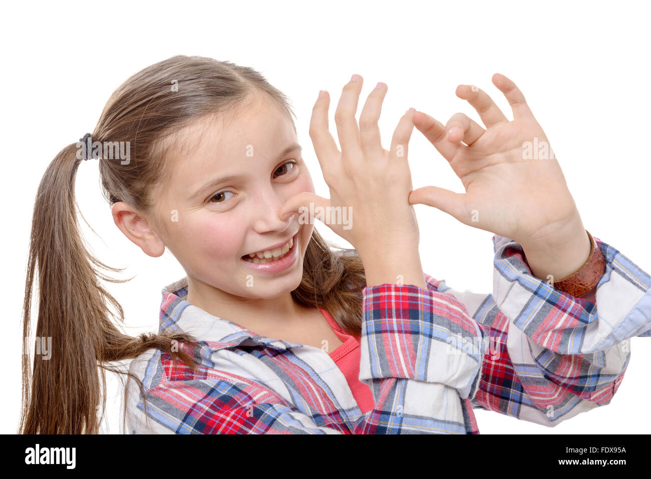a funny little girl making faces Stock Photo - Alamy