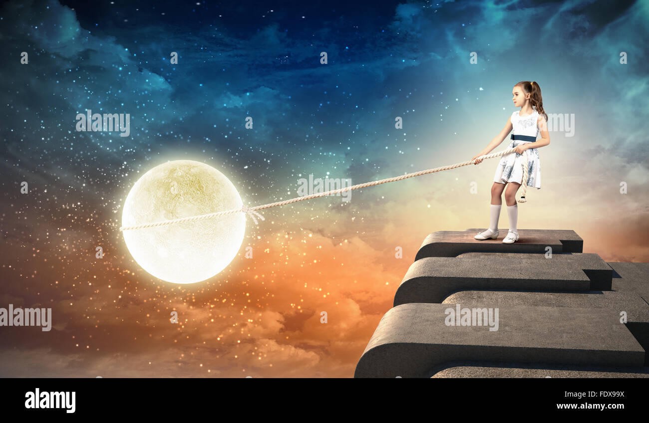 Image of little girl in white dress pulling moon Stock Photo - Alamy
