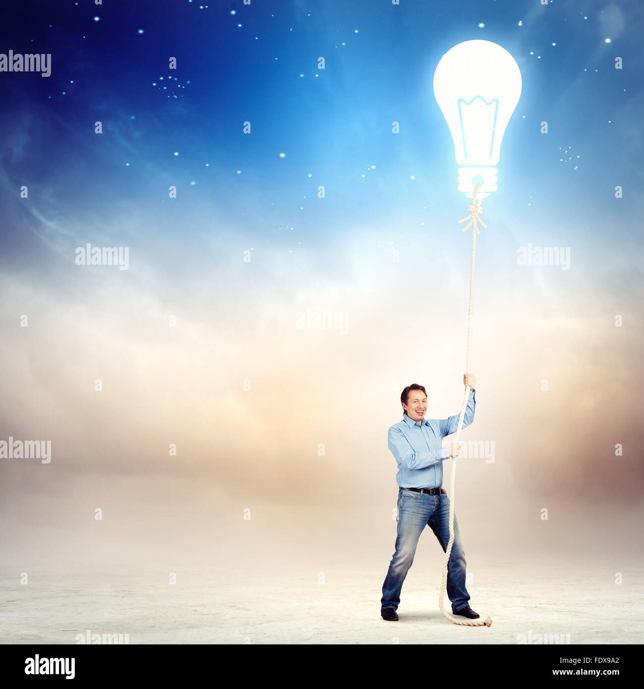 Image of adult handsome man pulling rope Stock Photo - Alamy