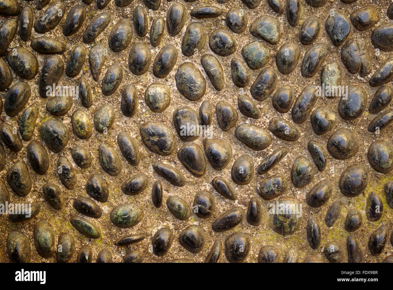 Round wall stones pattern background Stock Photo - Alamy