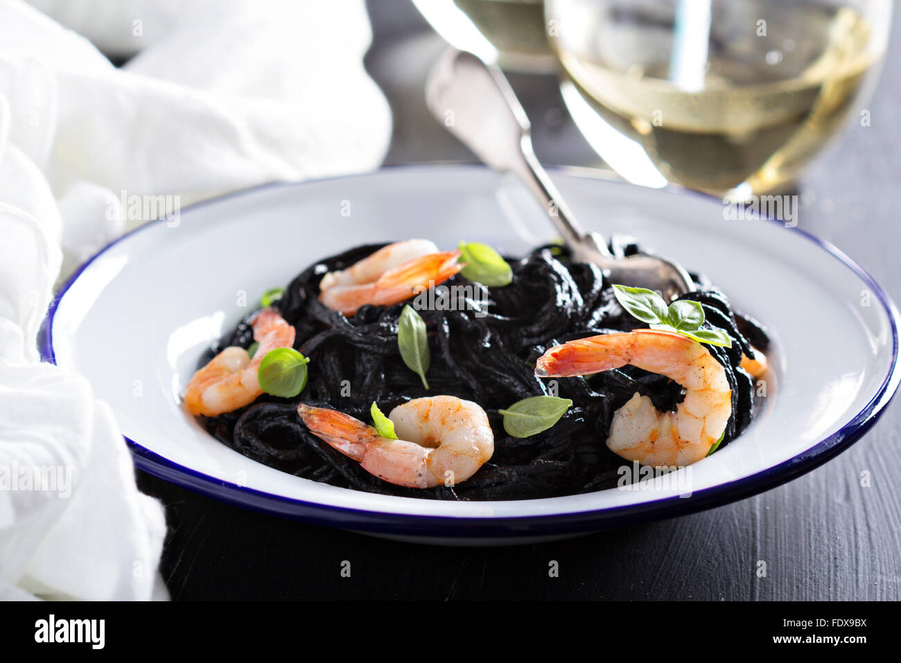 Squid ink homemade pasta with shrimp basil Stock Photo - Alamy
