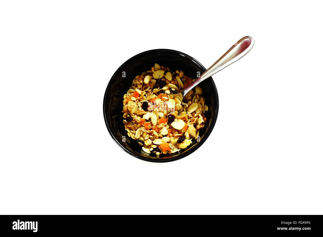 A bowl of granola photographed against a white background Stock Photo ...