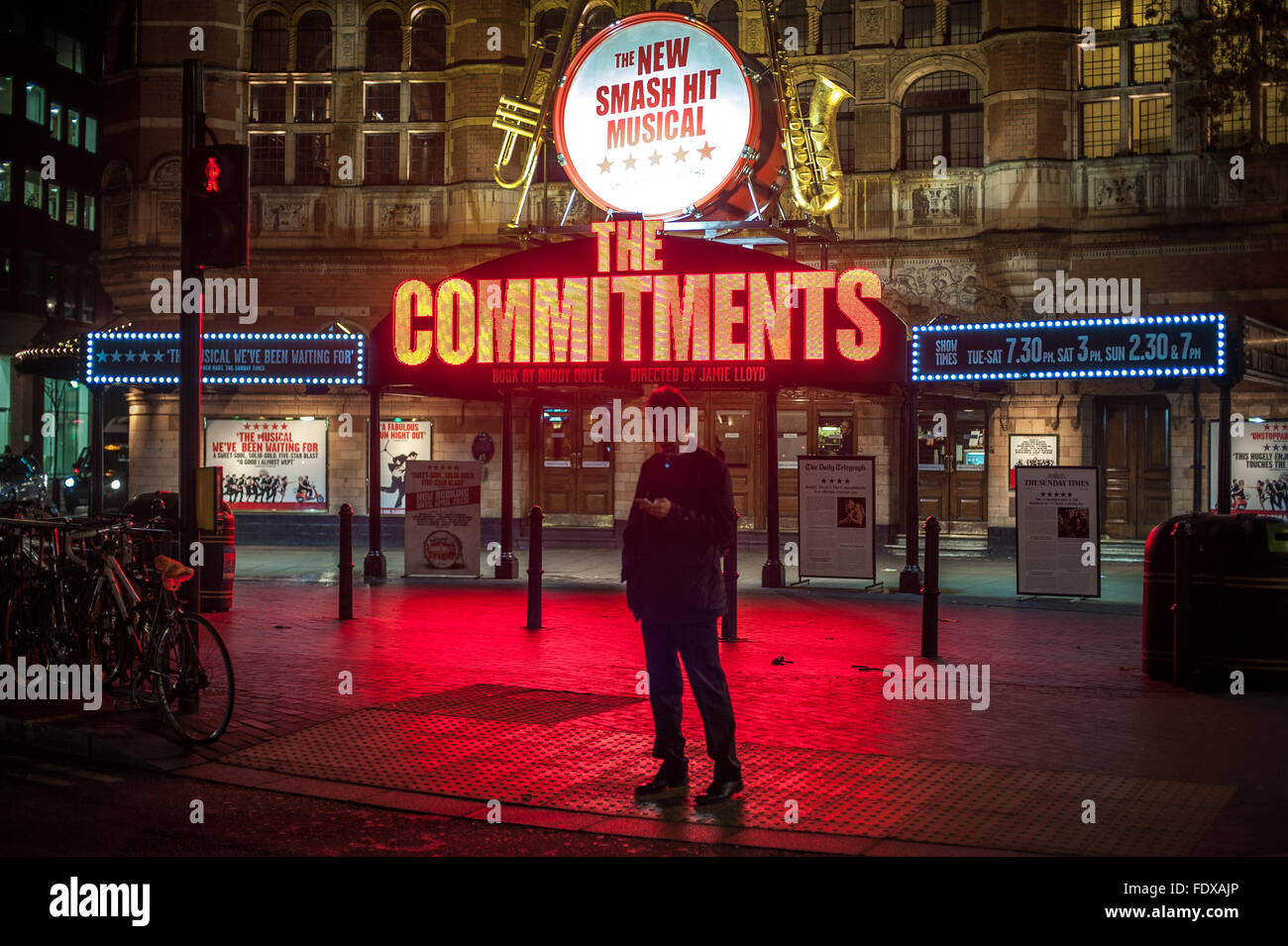 Man on mobile phone under "The Commitments" musical sign, Soho, London ...
