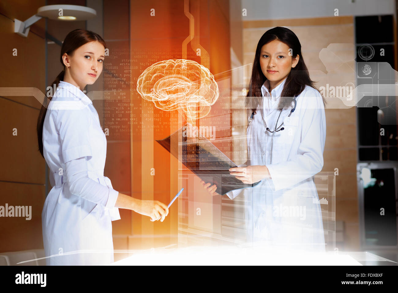 Image of two women doctors examining results Stock Photo - Alamy