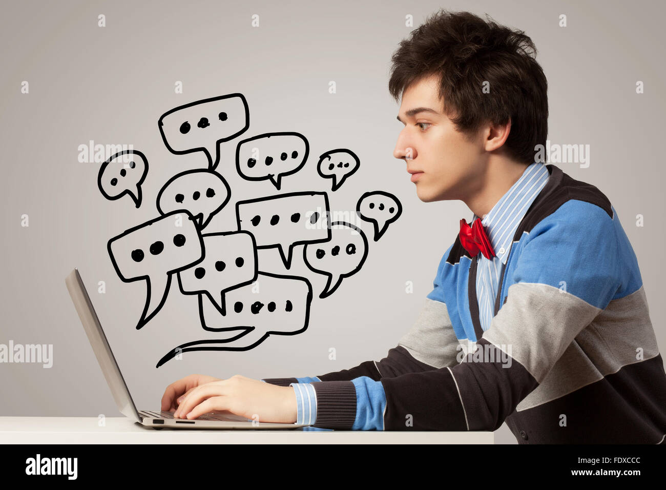 Young man in casual chatting using laptop Stock Photo - Alamy Young man in casual chatting using laptop Stock Photo - Alamy