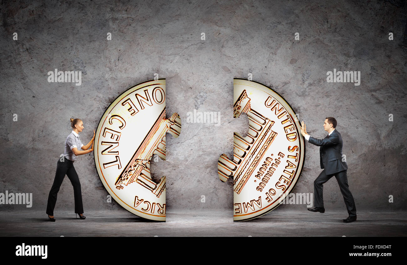 Two business people pulling coins. Currency concept Stock Photo - Alamy