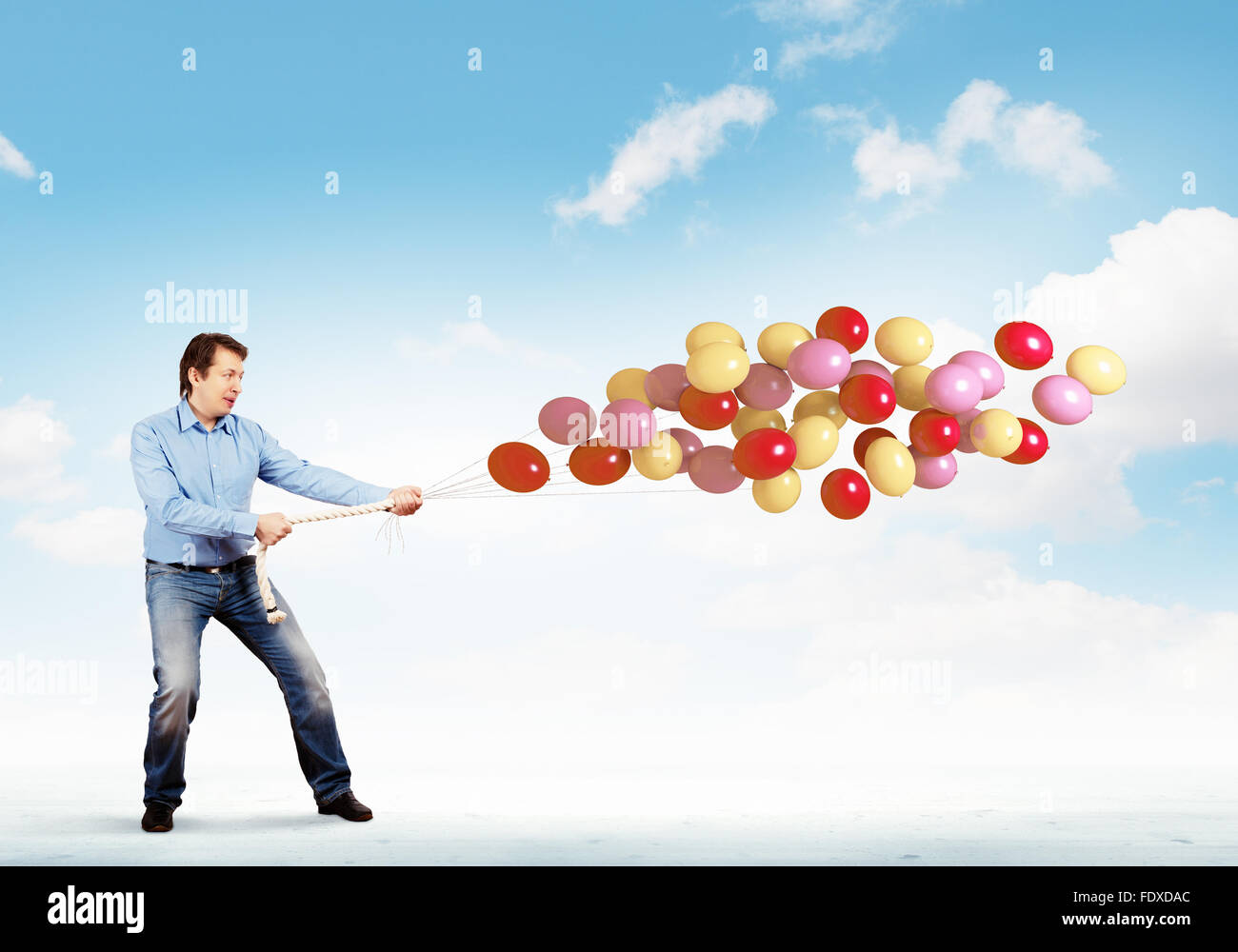 Image of adult man holding bunch of colorful balloons Stock Photo - Alamy