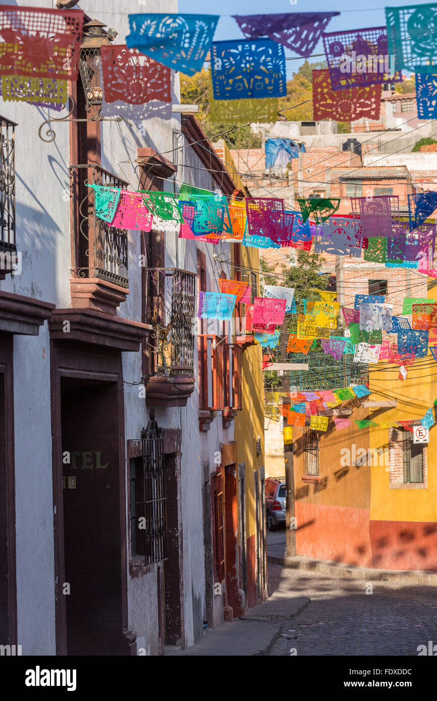 Festive papel picado banners decorate Calle Aparicio in the historic ...