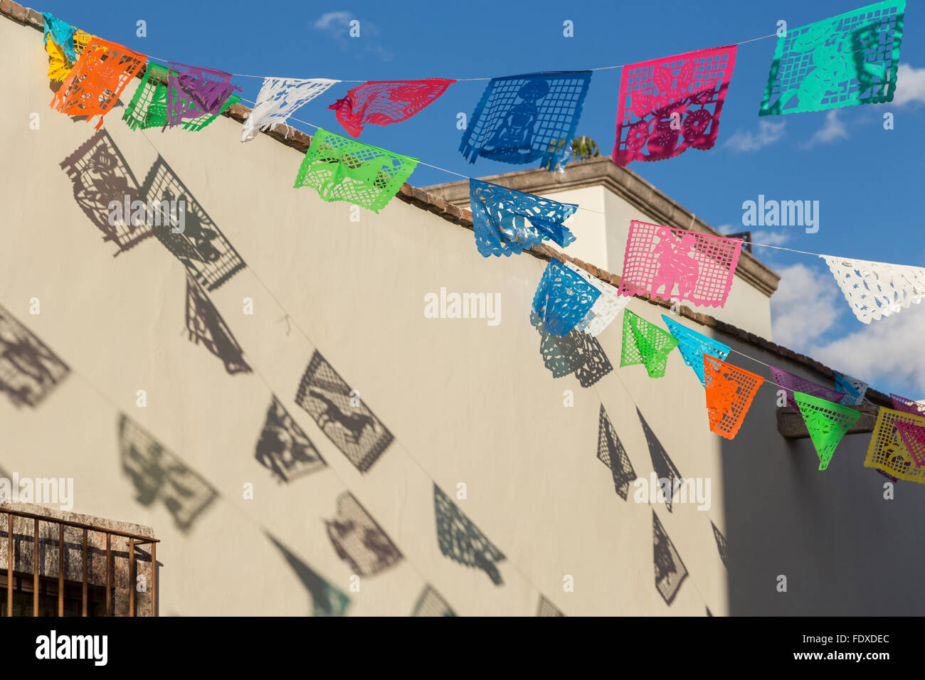 Festive papel picado banners decorate Calle Aparicio in the historic ...