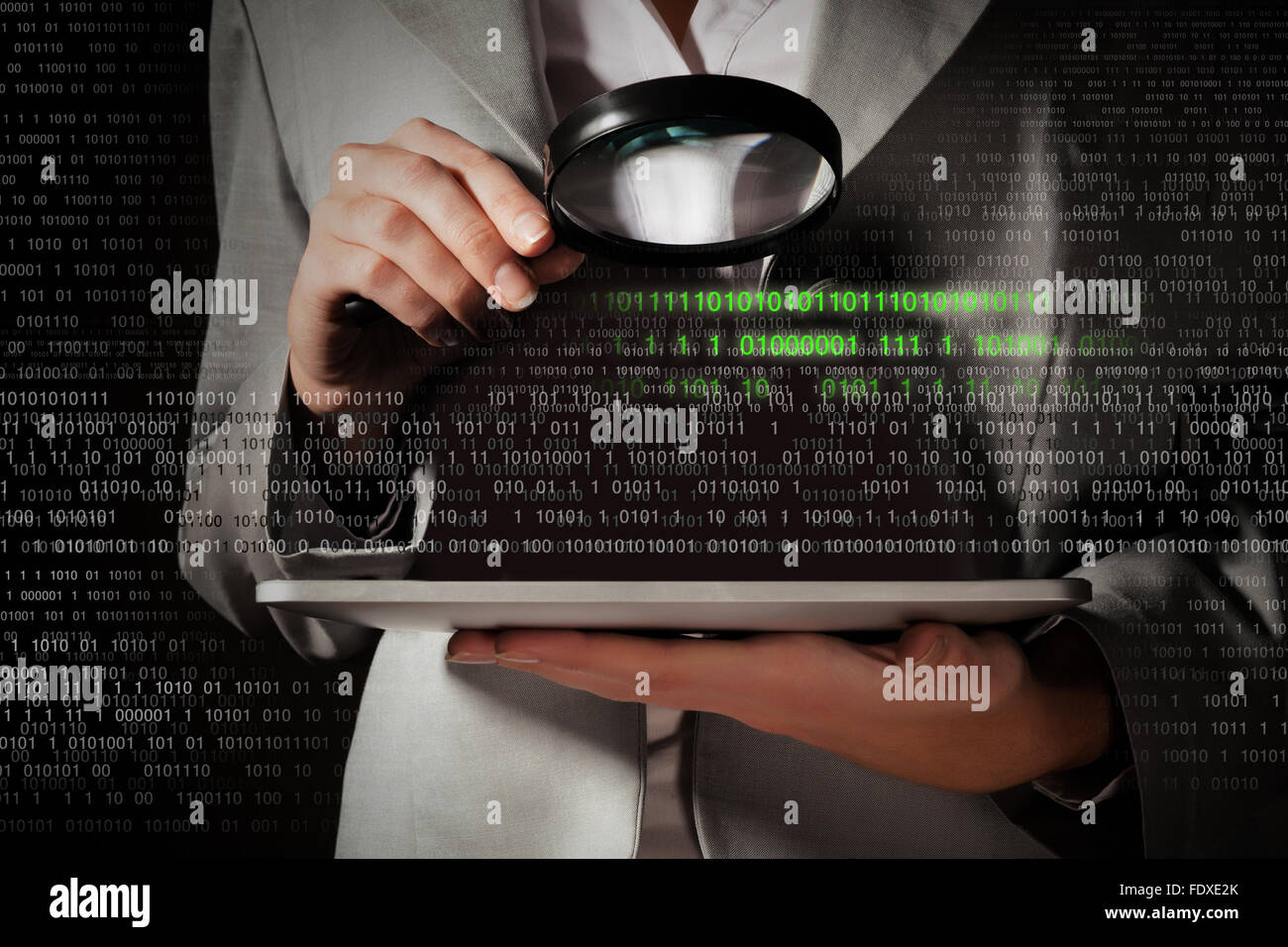Businesswoman with magnifier glass examining binary code Stock Photo ...