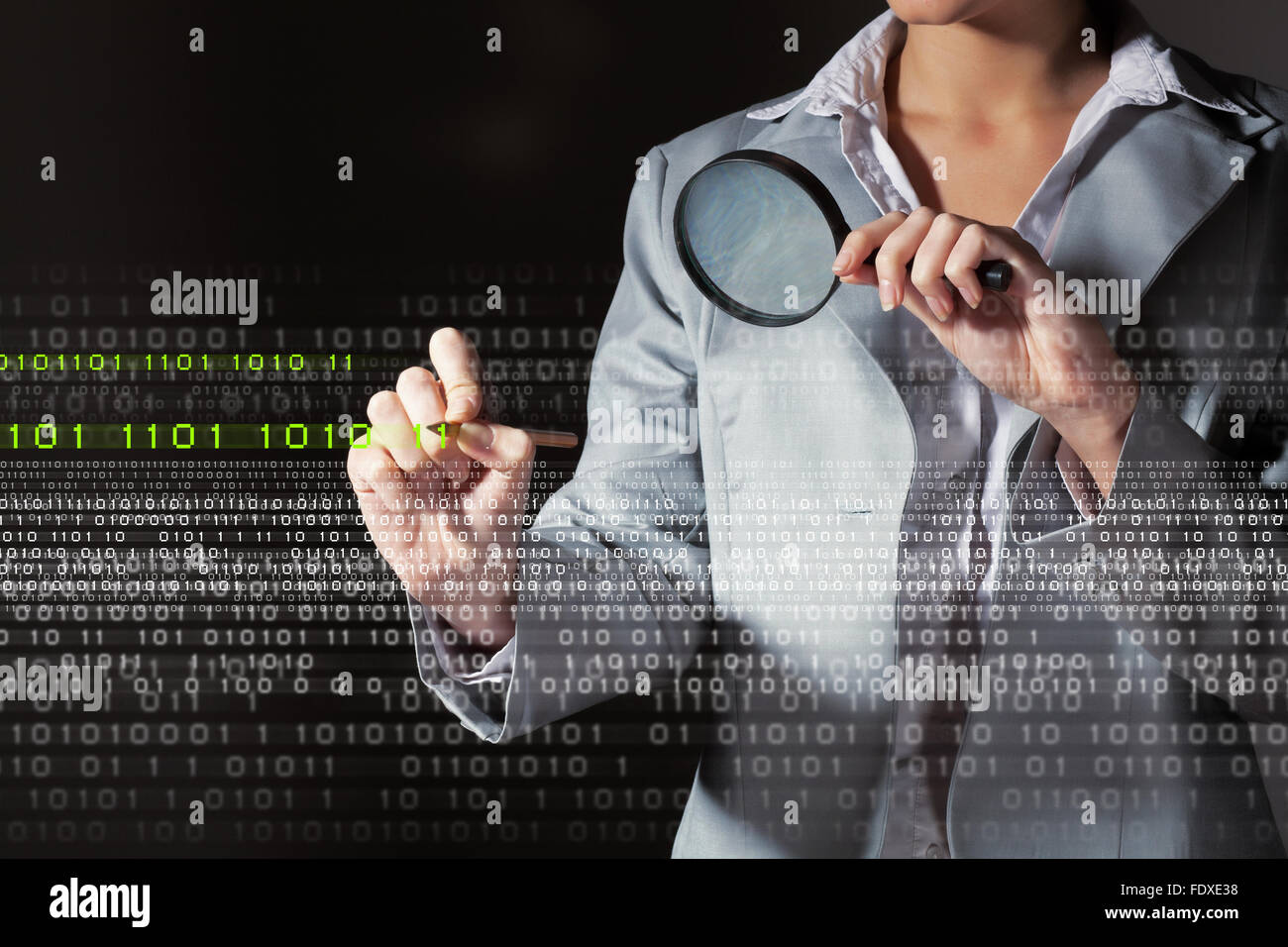 Businesswoman with magnifier glass examining binary code Stock Photo ...