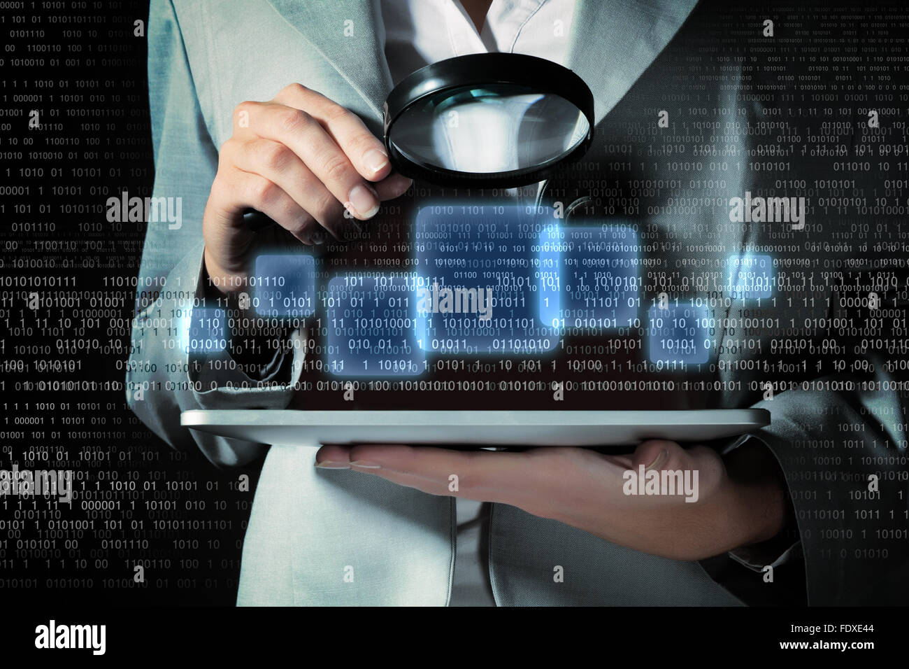 Businesswoman with magnifier glass examining binary code Stock Photo ...