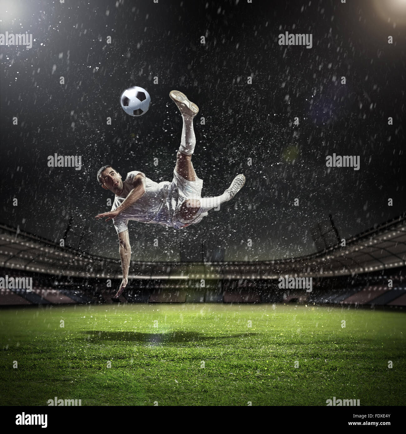 Image of football player at stadium hitting ball Stock Photo - Alamy