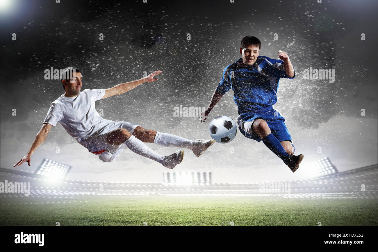 Image of two football players at stadium Stock Photo - Alamy