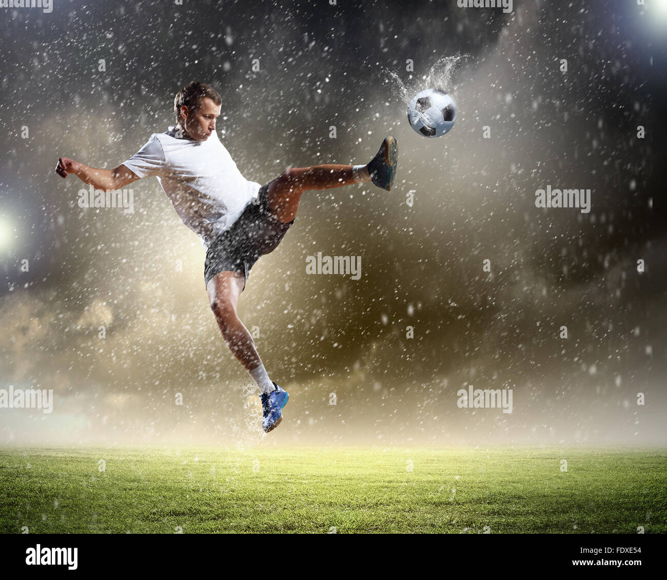 Image of football player at stadium hitting ball Stock Photo - Alamy
