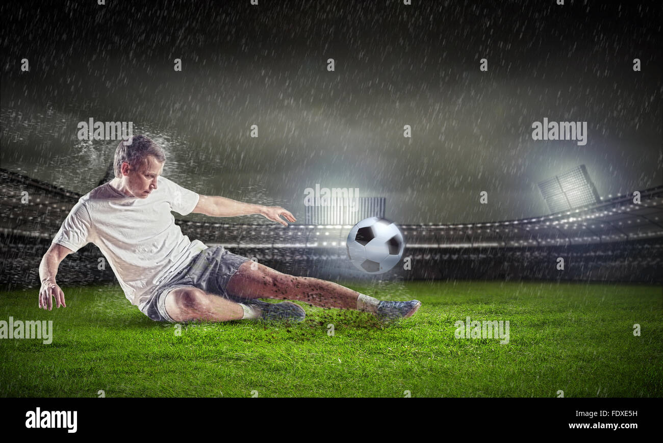 Image of football player at stadium hitting ball Stock Photo - Alamy