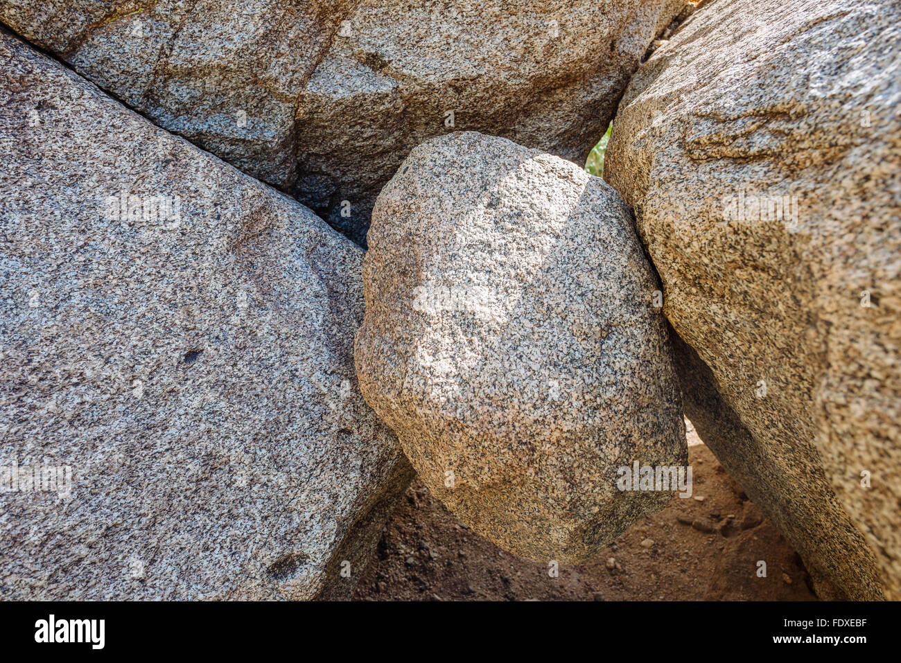 A stone wedged between two boulders in Hellhole Canyon, Anza-Borrego ...