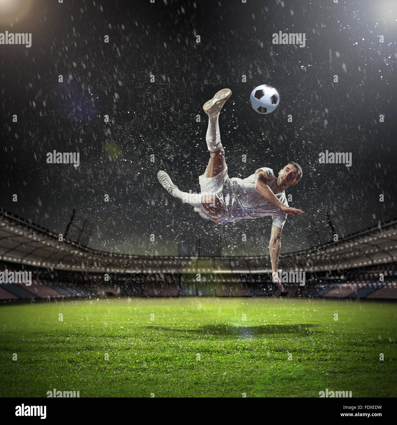Image of football player at stadium hitting ball Stock Photo - Alamy