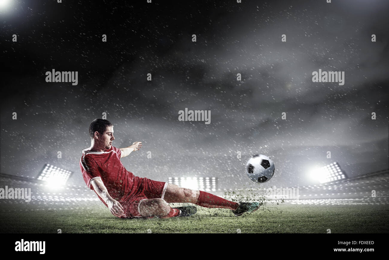 Image of football player at stadium hitting ball Stock Photo - Alamy