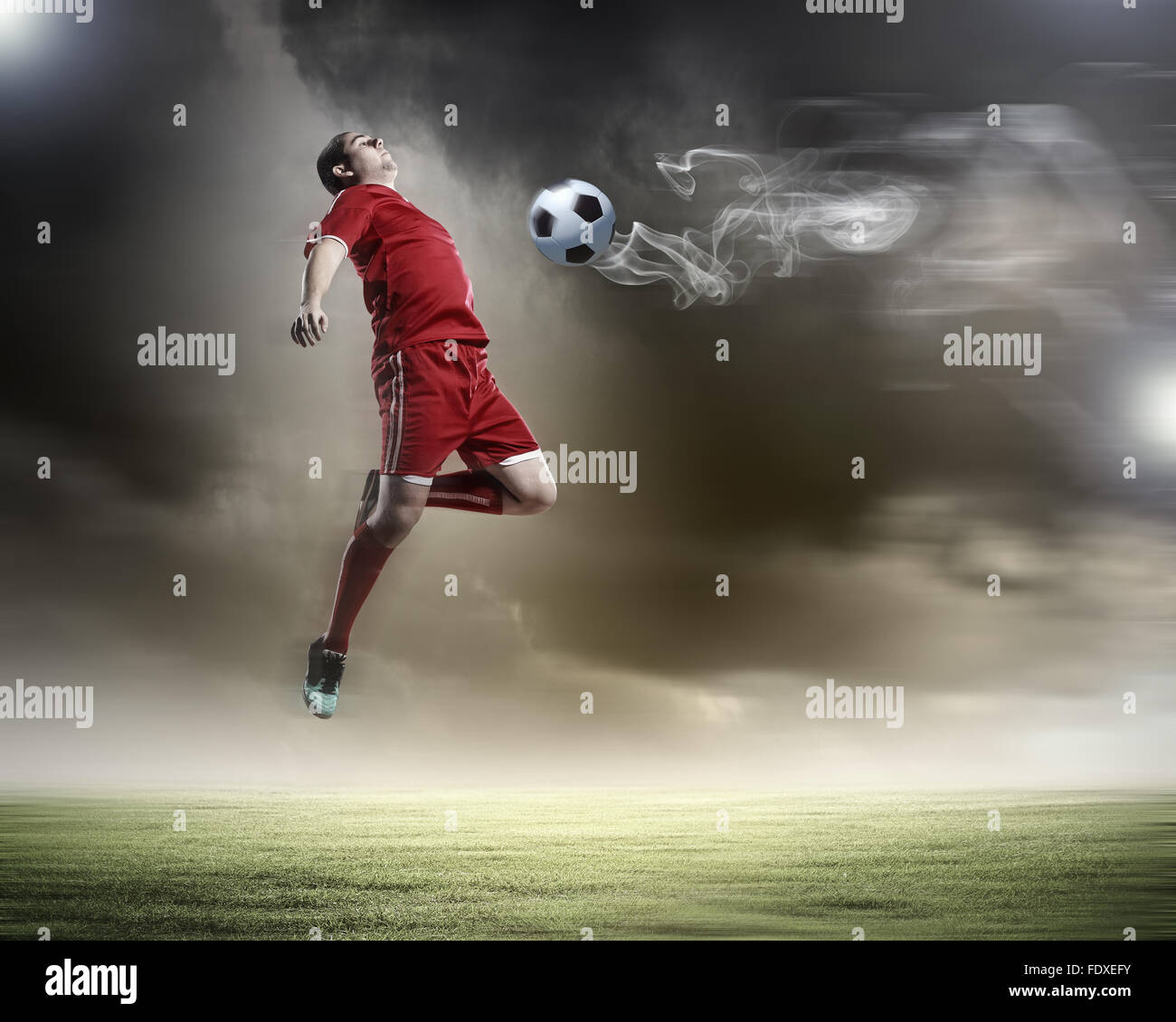 Image of football player at stadium hitting ball Stock Photo - Alamy