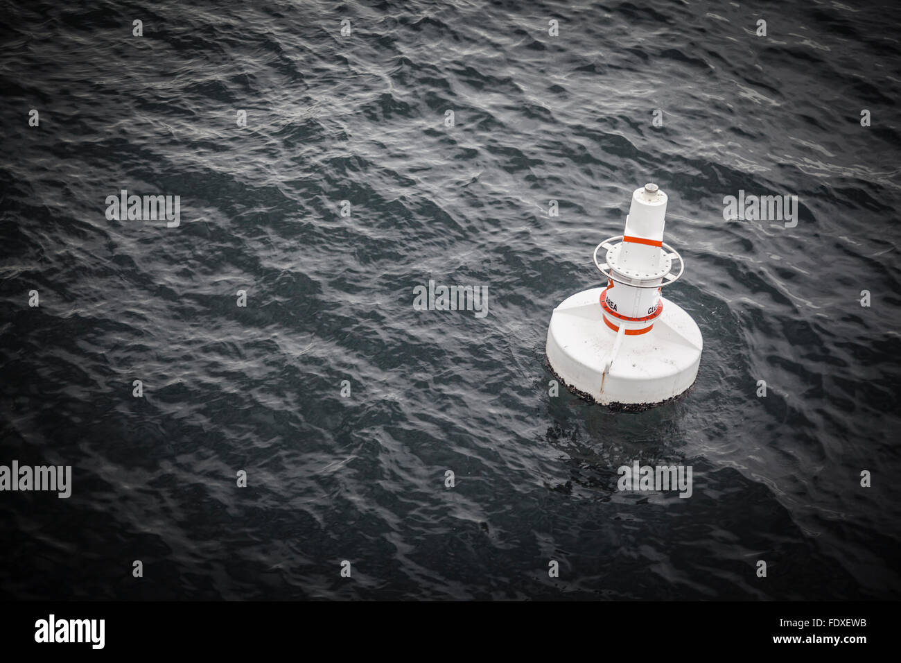 Floating red navigational buoy on blue sea hi-res stock photography and ...
