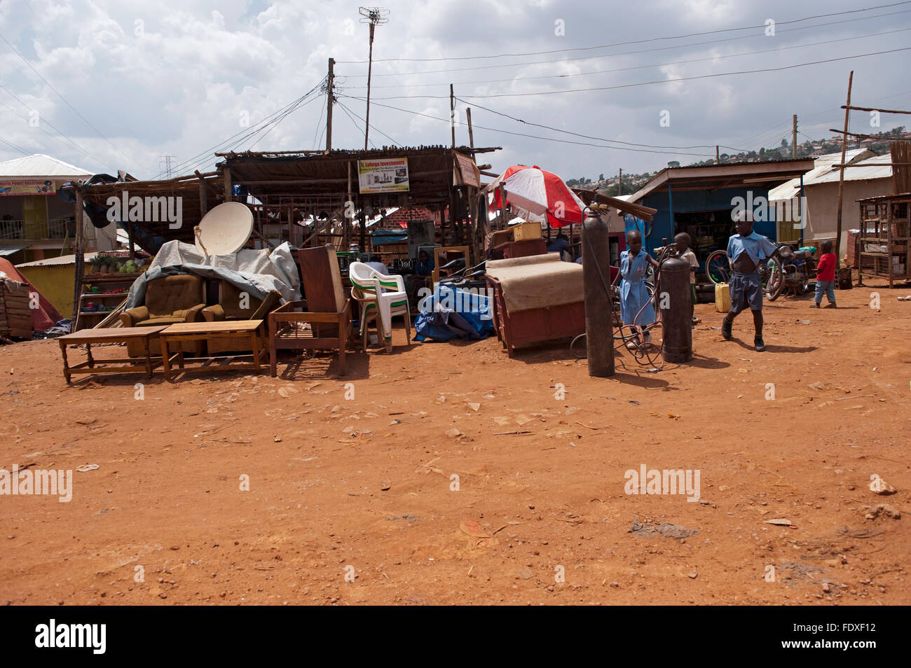 Roadside village scenes in rural Uganda, showing shops and stores along ...