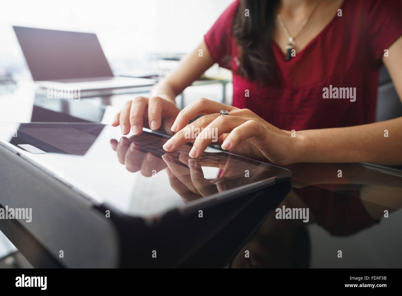 Closeup of hands of female computer technician sitting and typing on ...